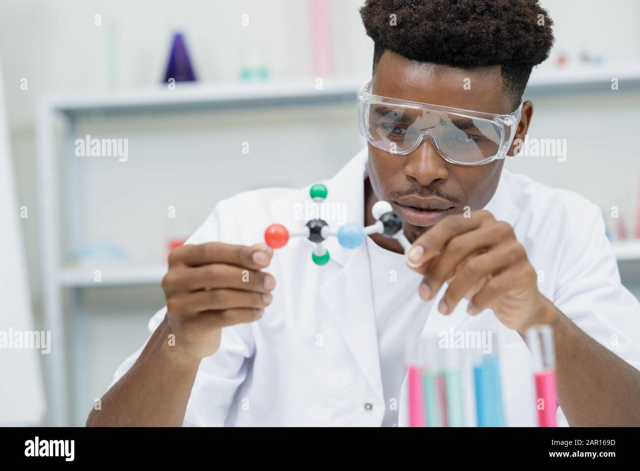 scientist man holding molecule form isolated on Stock Photo - Alamy