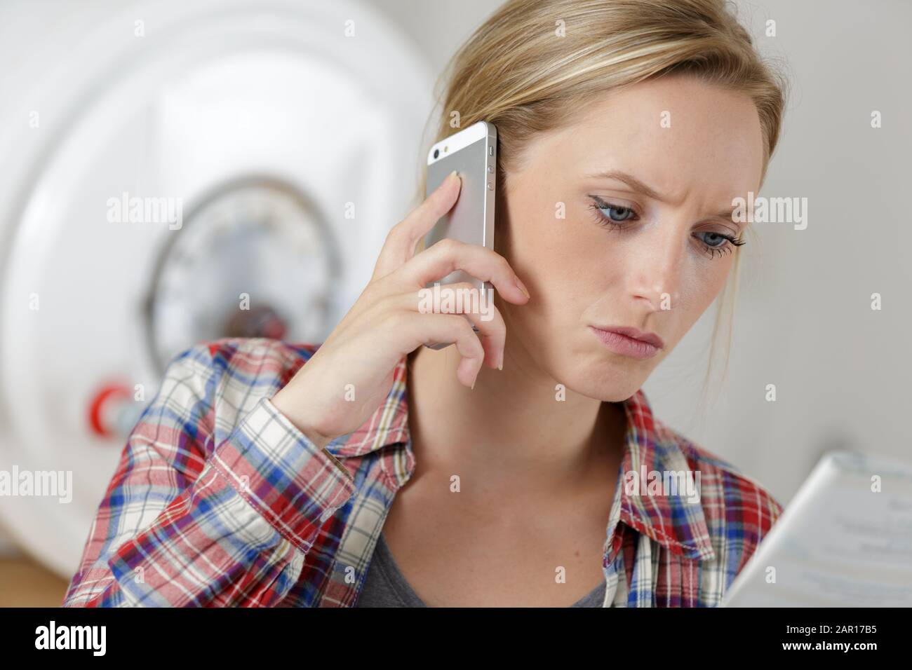 female plumber on the phone Stock Photo - Alamy