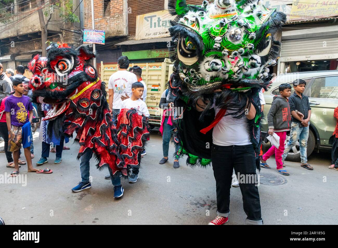 Chinese community members perform lion dance on street during the ...