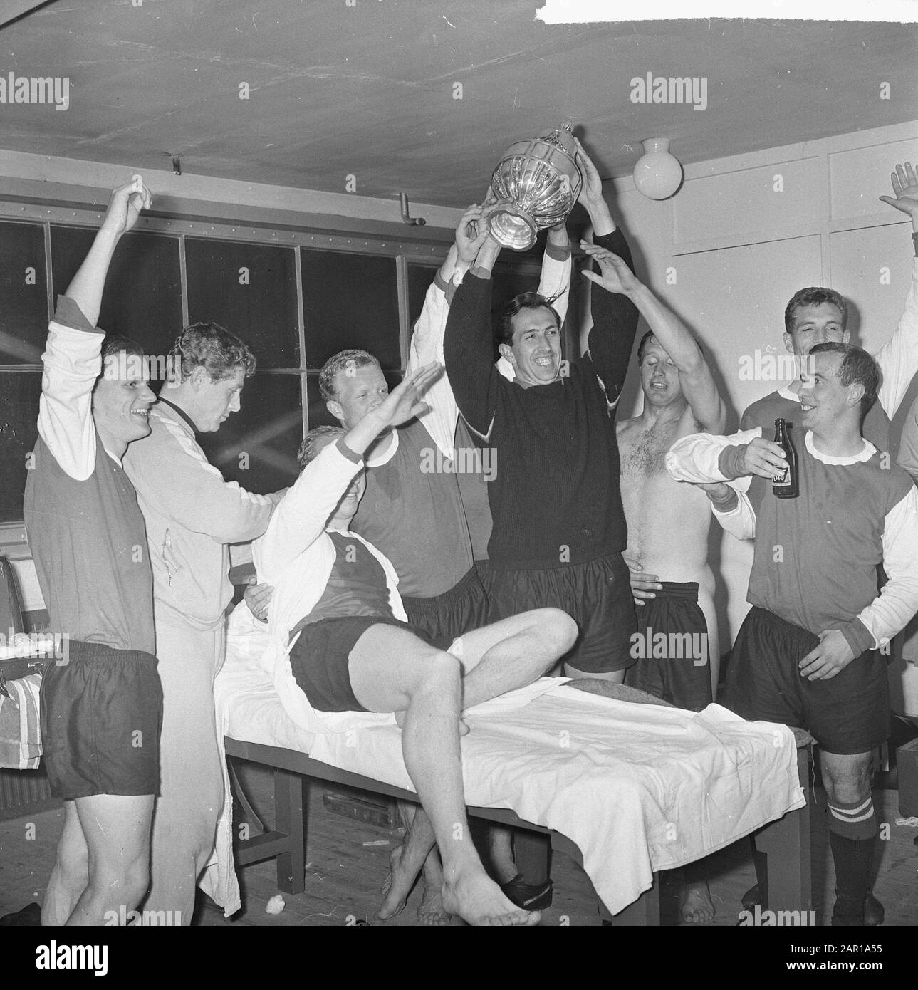 Football players dressing in Black and White Stock Photos & Images - Alamy