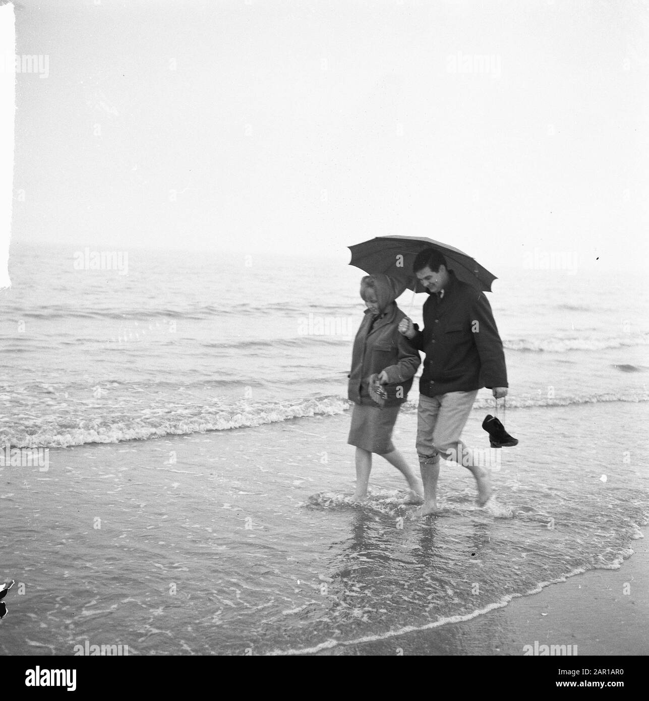 Bad weather with Pentecost, umbrella at the beach Date: June 5, 1965 ...