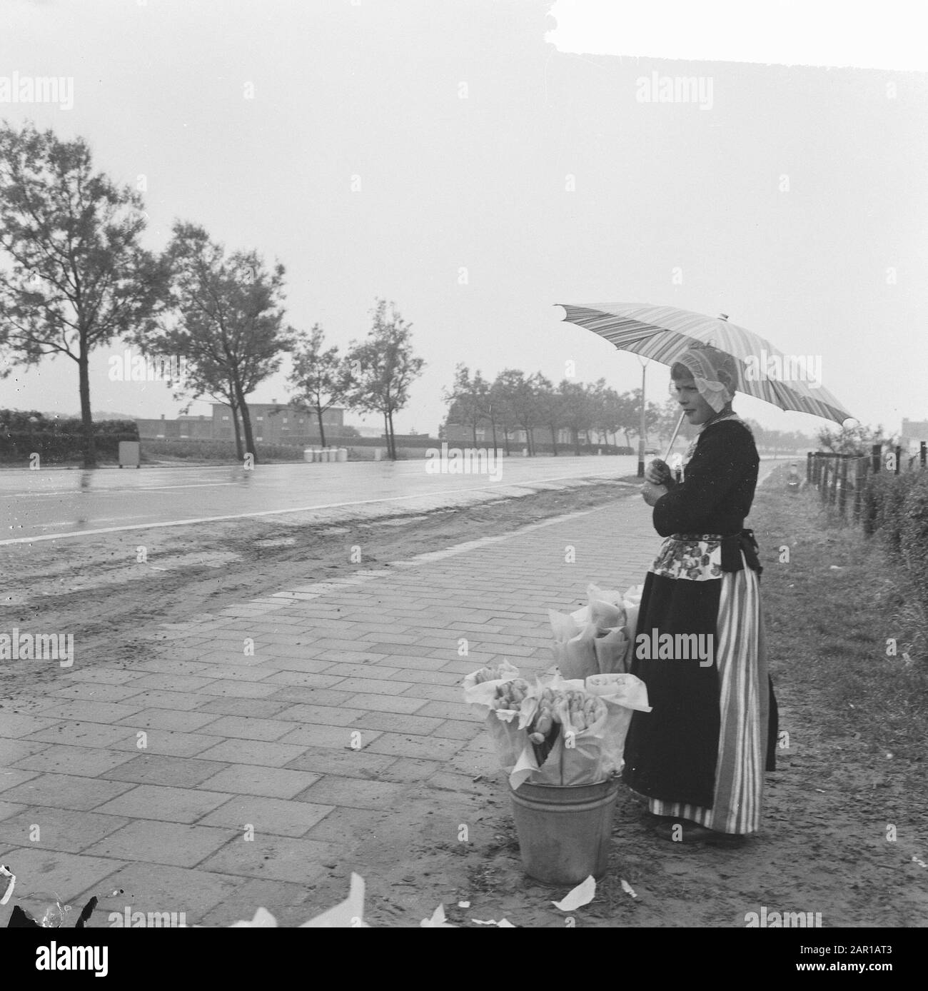 Bad weather with Pentecost, people with umbrella Date: June 5, 1965 ...