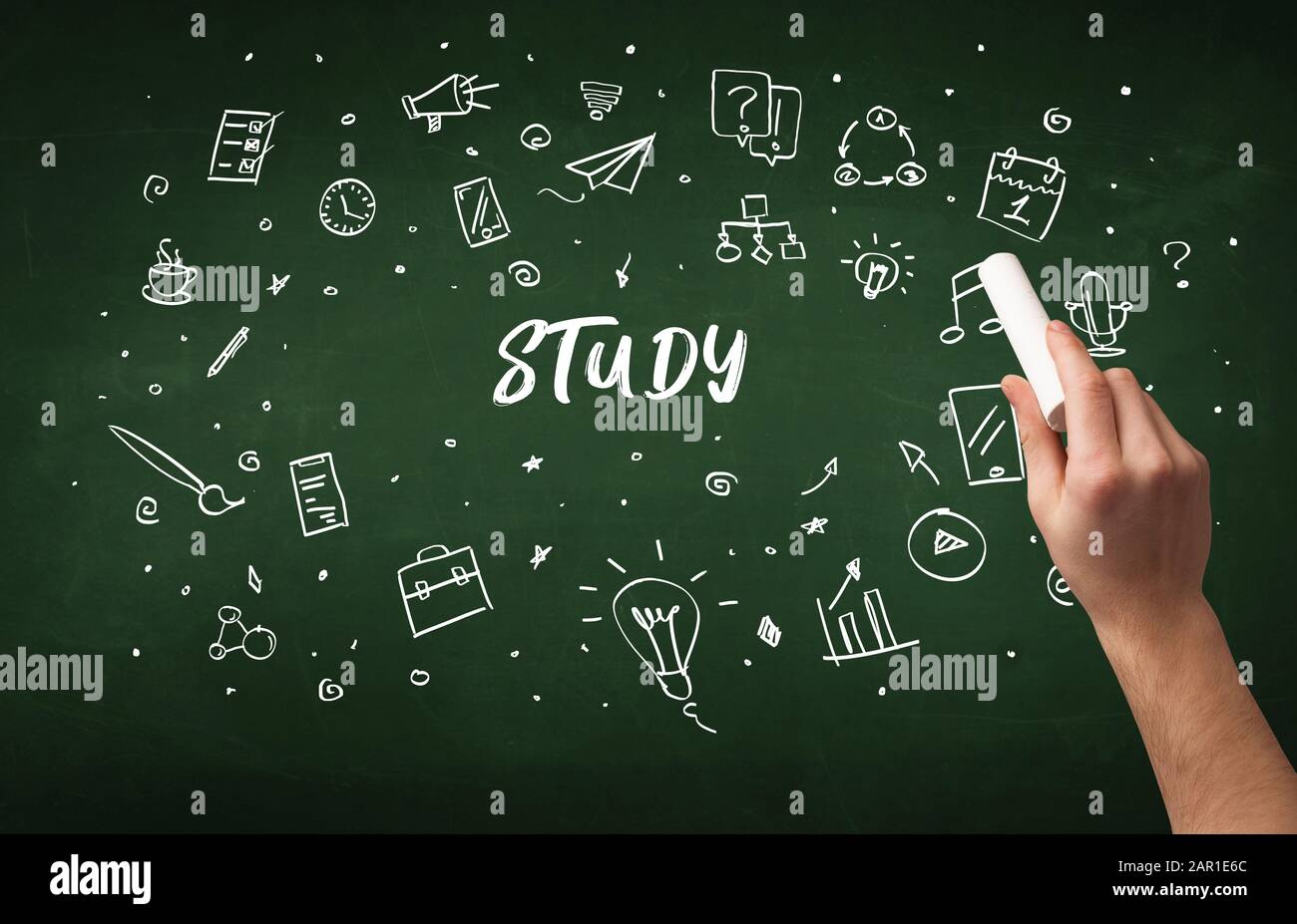 Hand drawing STUDY inscription with white chalk on blackboard ...