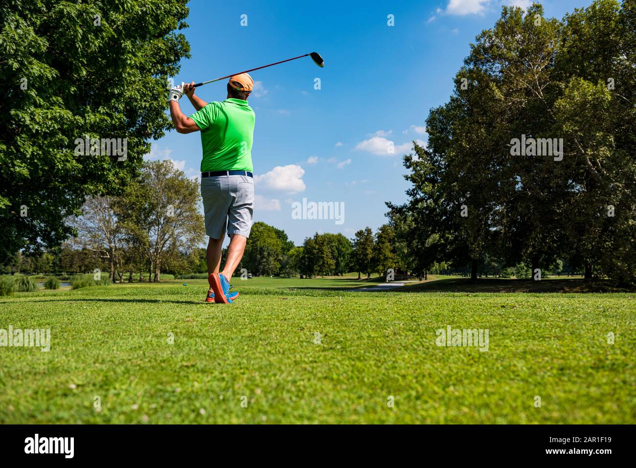 Hitting the perfect golf shot Stock Photo - Alamy
