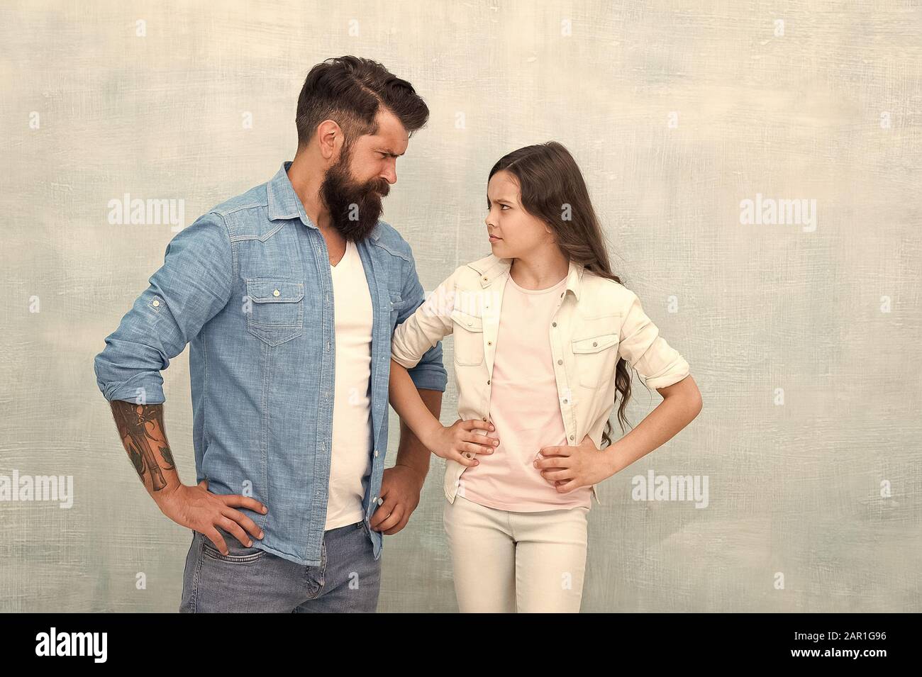 Sometimes parenting is about misunderstanding. Family conflict. Bearded hipster man and child ...