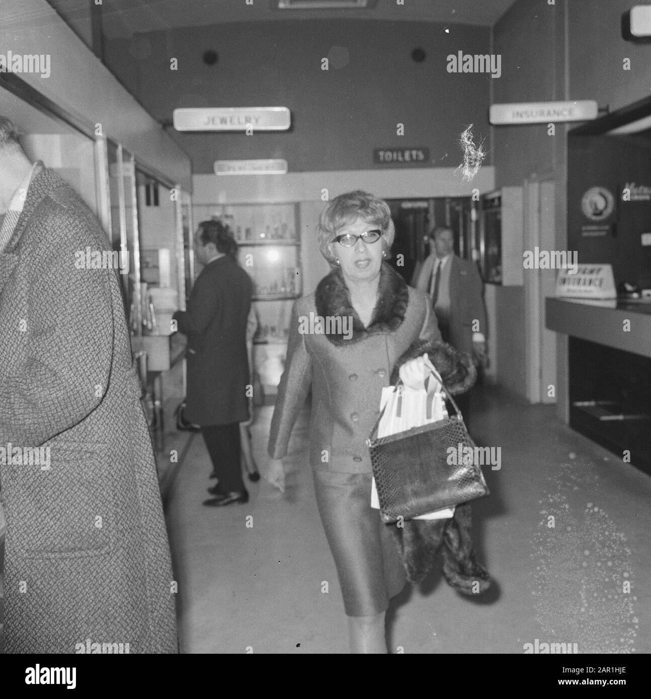 French singer and actress Josephine Baker shopping at Schiphol Airport ...