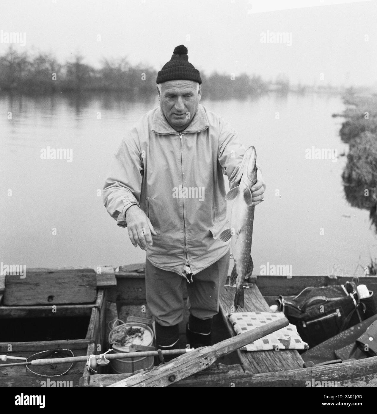 Man rowing boat boats Black and White Stock Photos & Images - Alamy