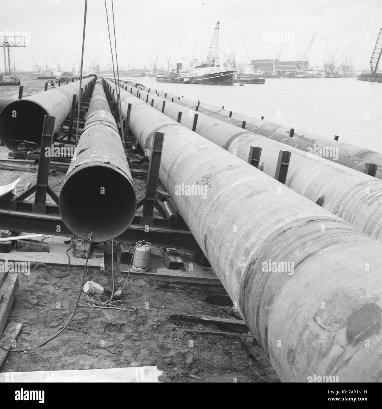 Water pipe for Rotterdam, on beach near the Waalhaven transverse slope ...