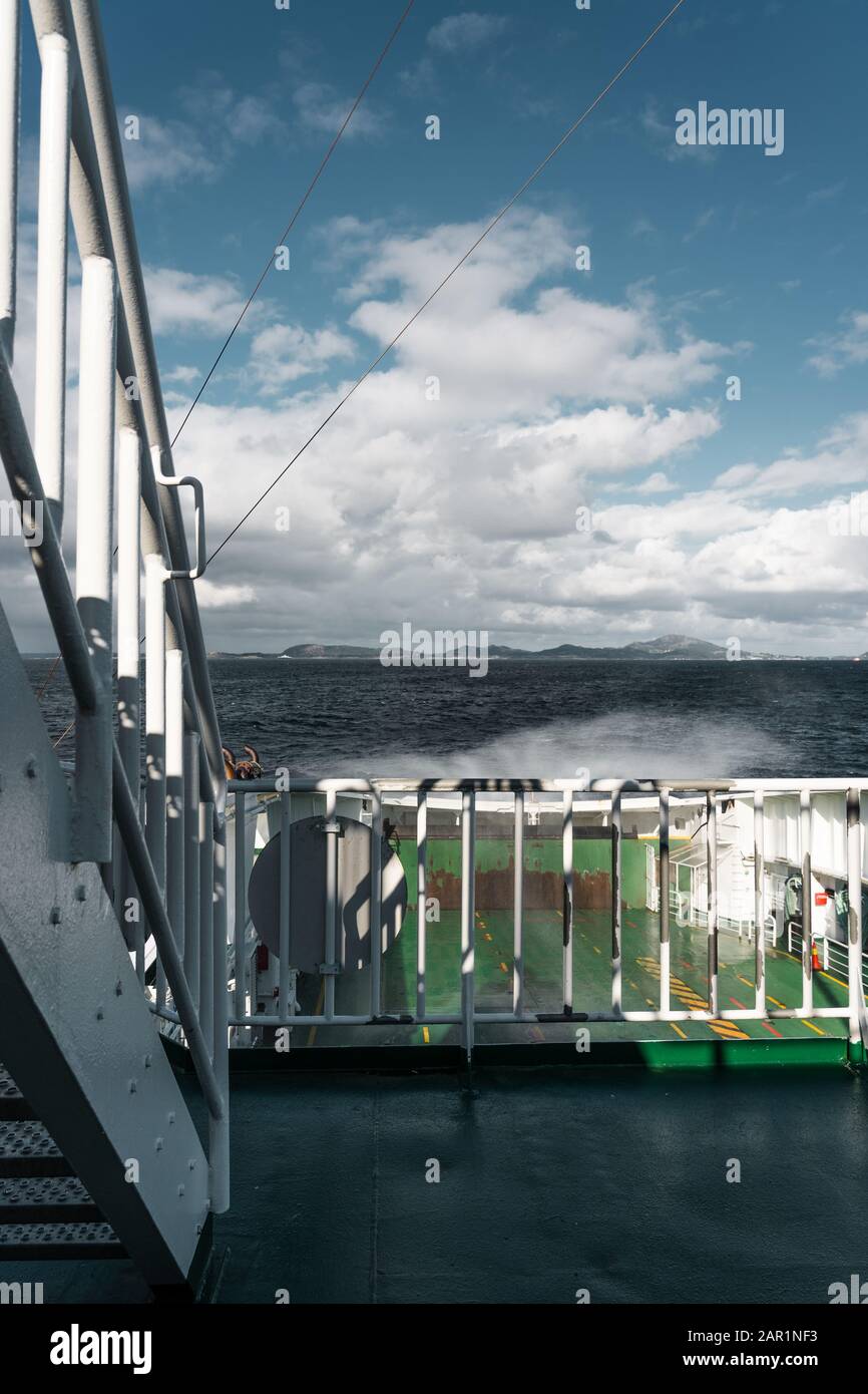Harsh sea between Mortavika and Arsvågen with water spraying on the car ...