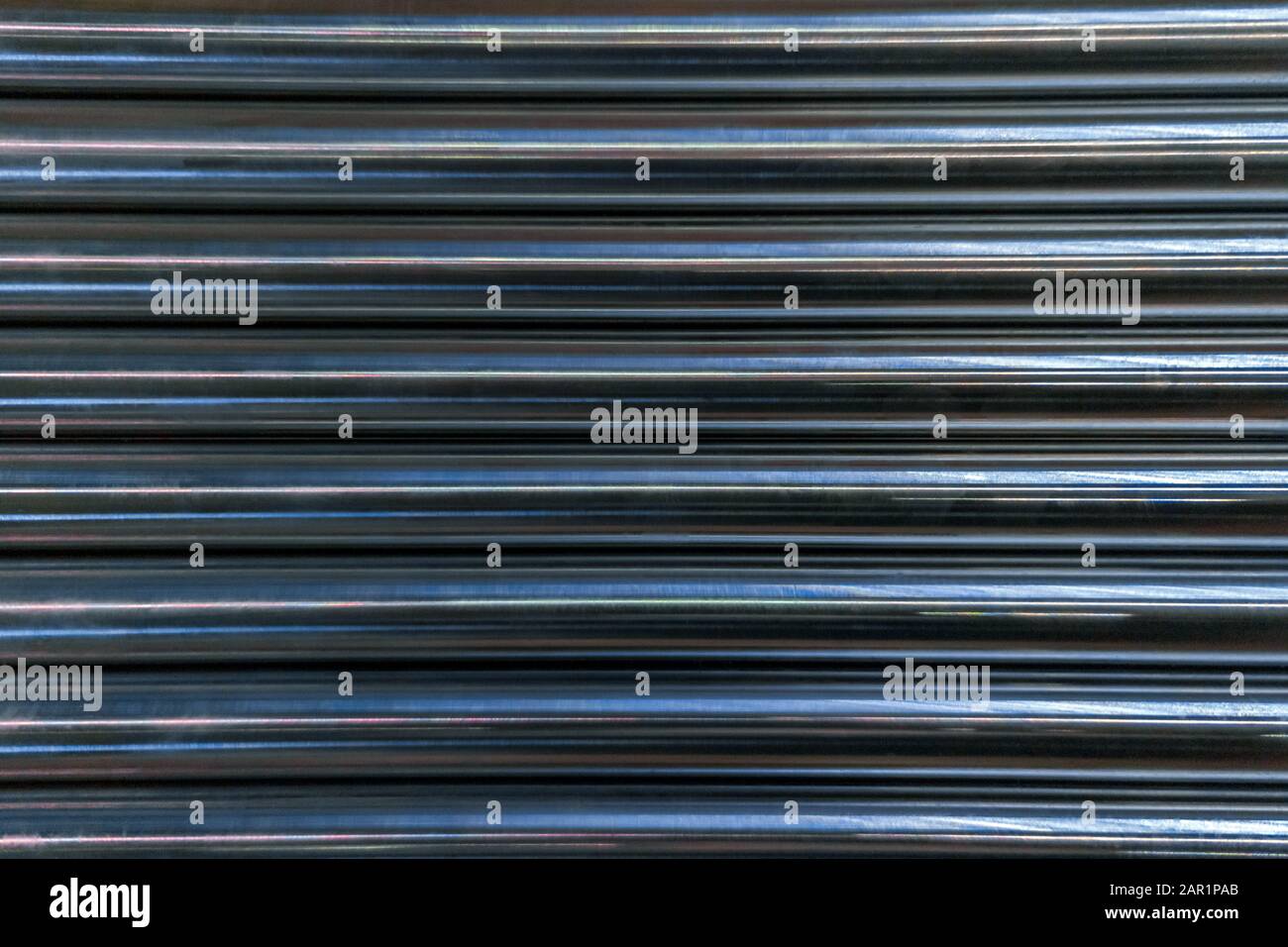 abstract industrial background of shiny cnc turned rods with flat lay ...