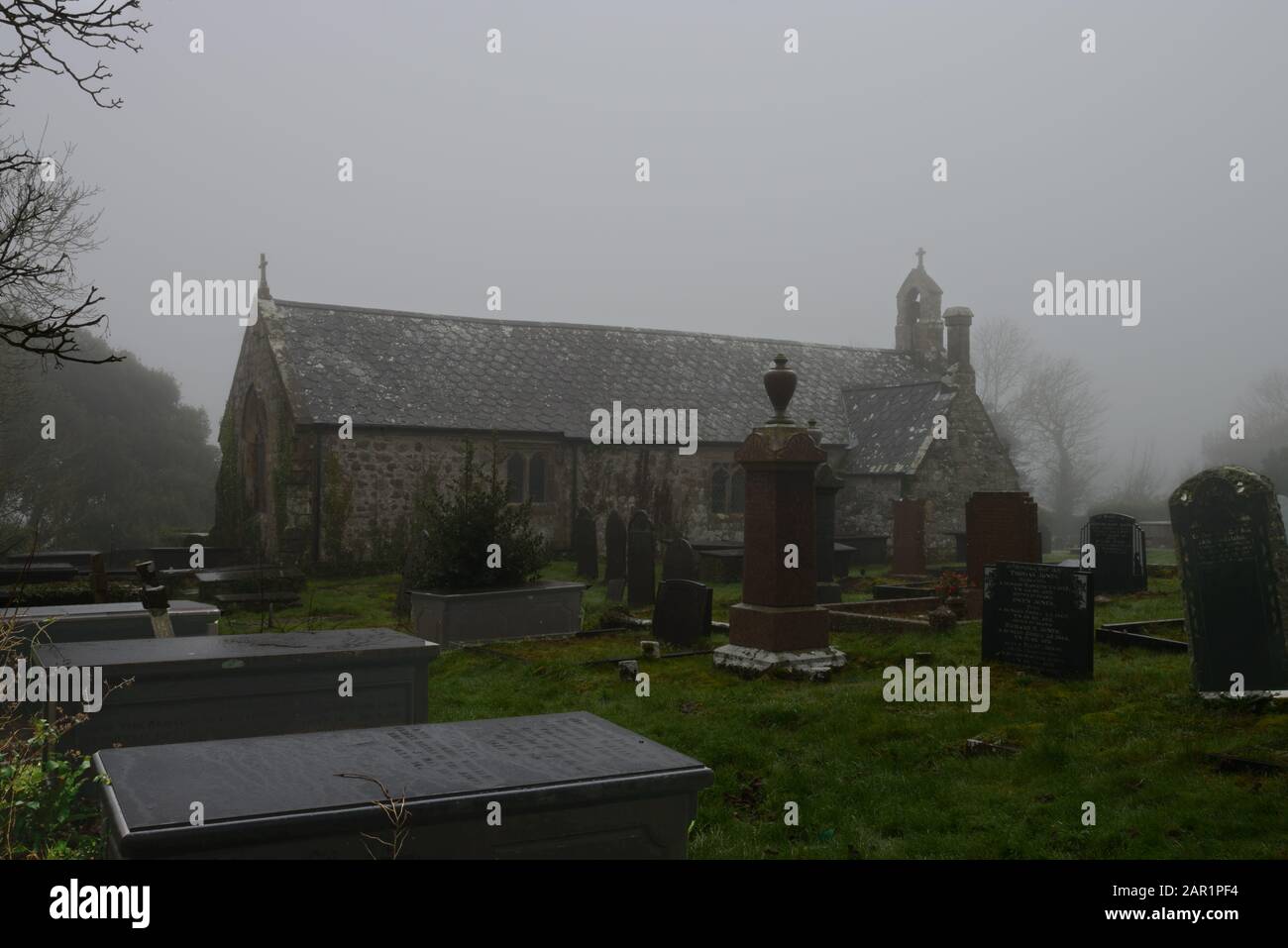 St Beuno's Church in Trefdraeth, Anglesey, here seen in the mist, is a ...