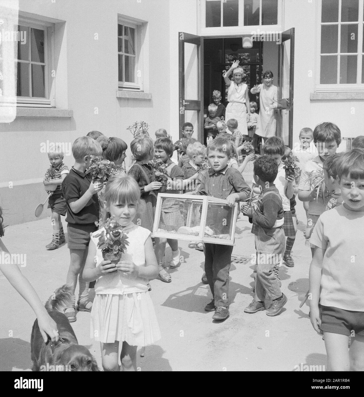 School holidays started, children with plants, goldfish and hamster ...