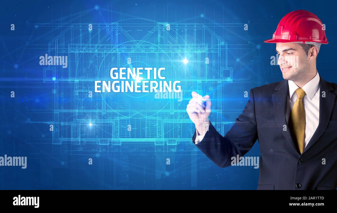 Handsome architect with helmet drawing GENETIC ENGINEERING inscription ...