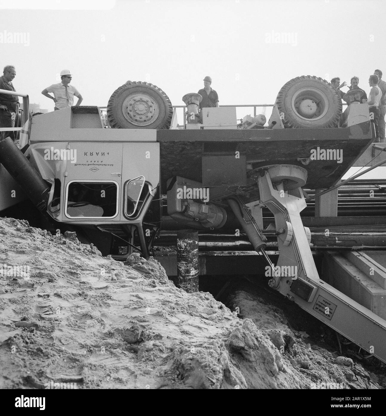 Crane overturned at the Hornweg. Driver's cabin heavily printed Date ...