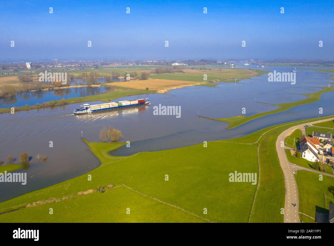 Inland container barge on River Lek aerial view near the village of ...