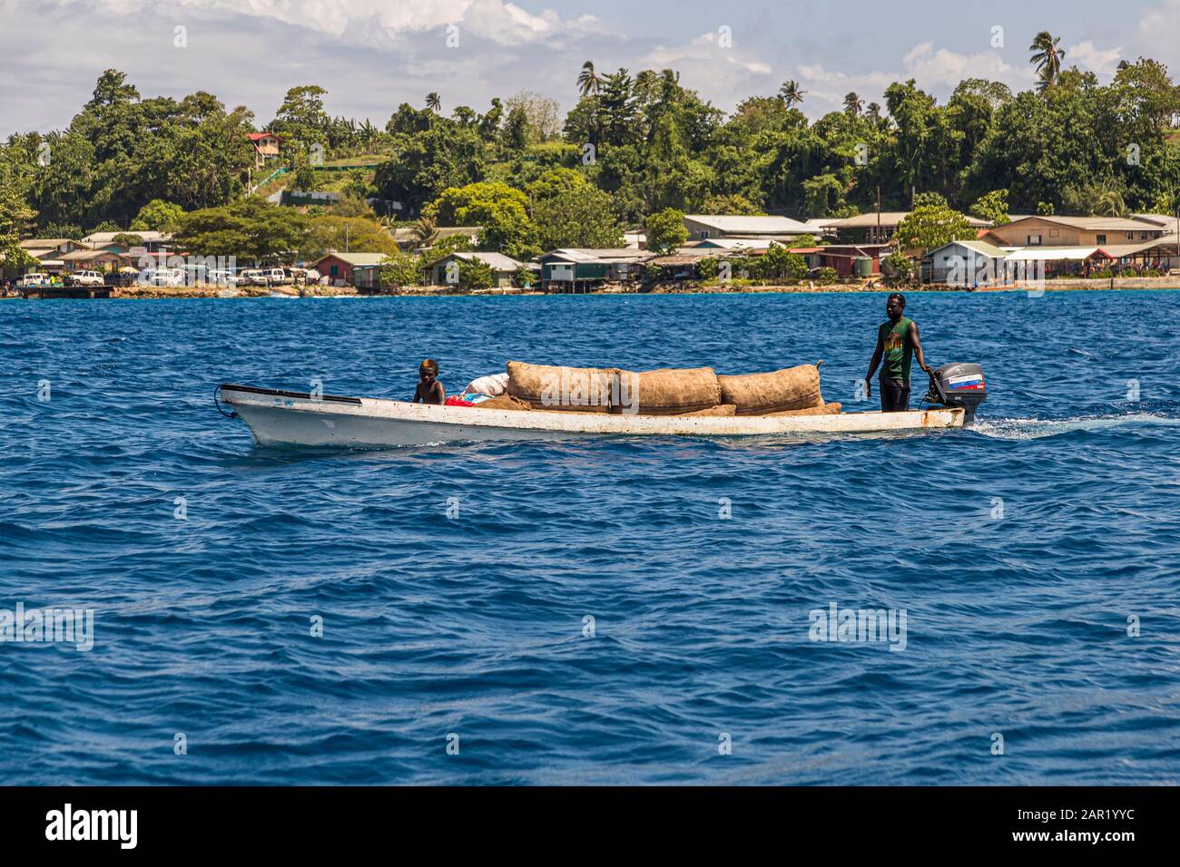 Small transport boat loaded with copra, Bougainville, Papua New Guinea ...