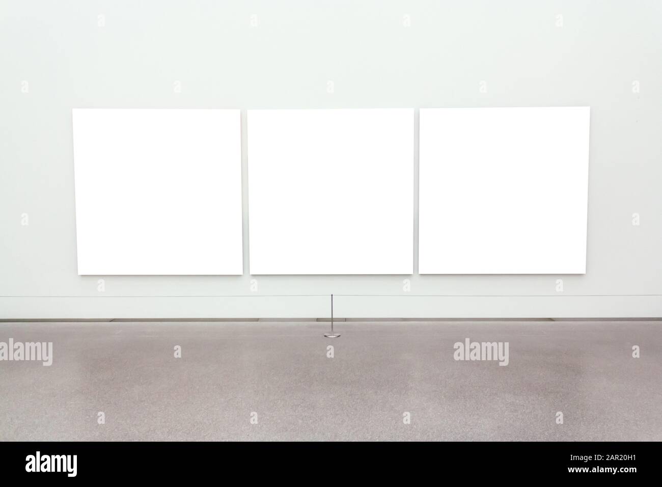 Square white surfaces attached to a wall in a room Stock Photo - Alamy