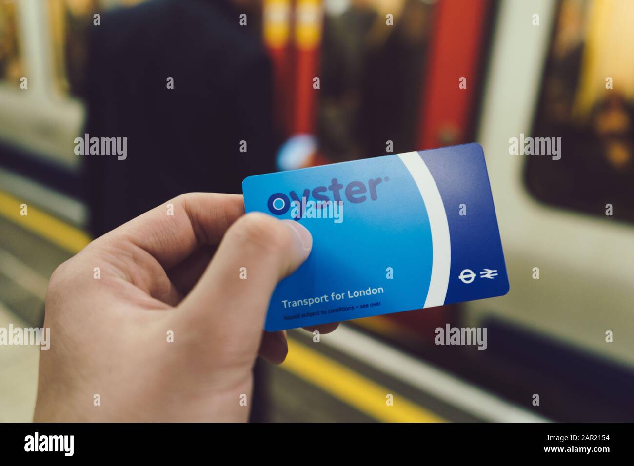 LONDON, UNITED KINGDOM - Nov 11, 2019: Male hand holding London Oyster ...