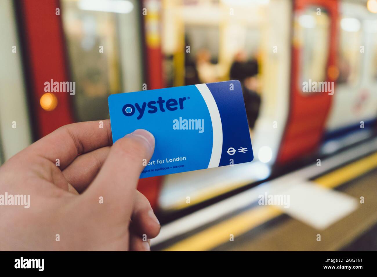 LONDON, UNITED KINGDOM - Nov 11, 2019: Male hand holding London Oyster ...