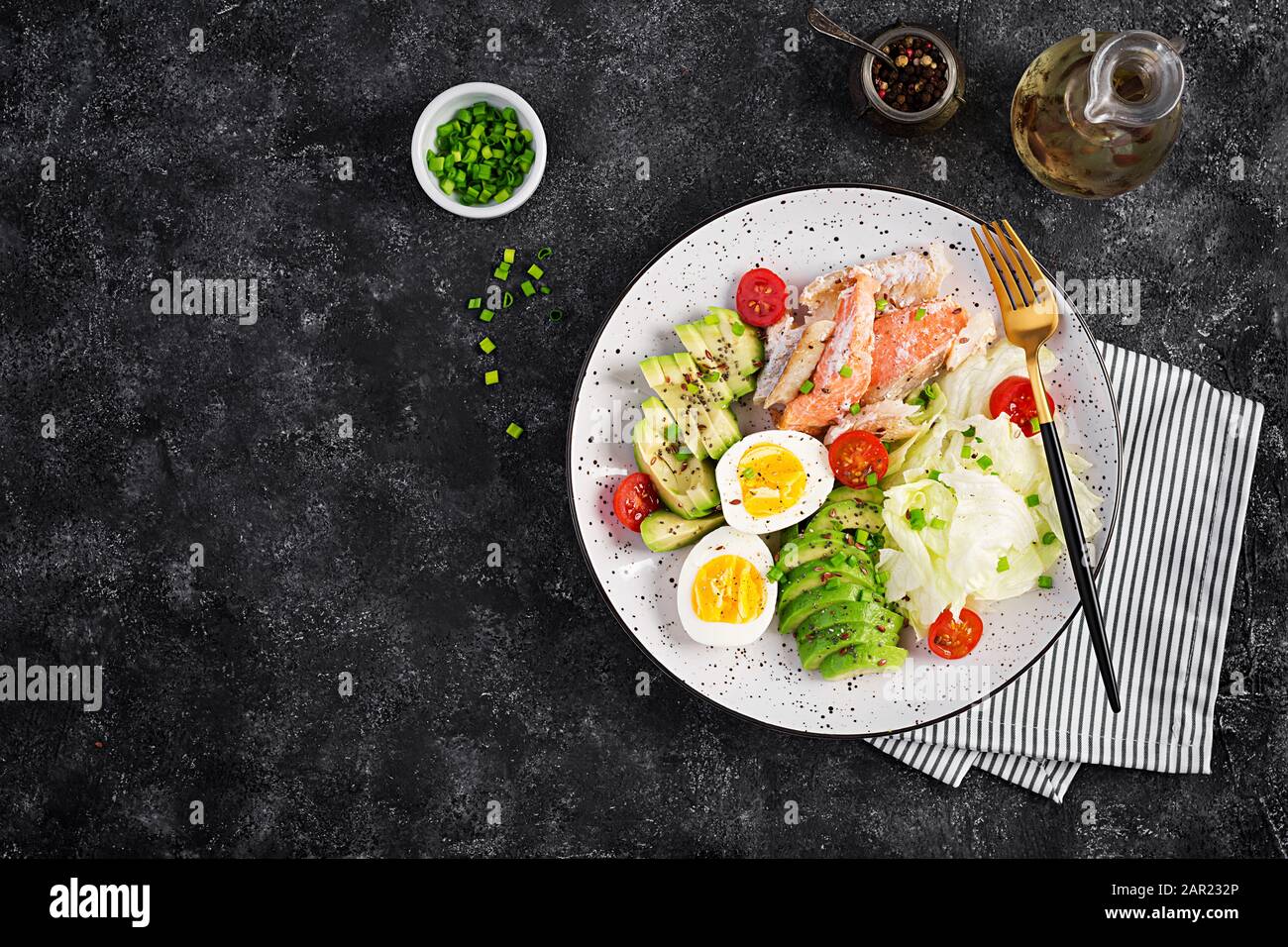 Ketogenic diet, breakfast. Eggs, fish and avocado, lettuce and seeds ...