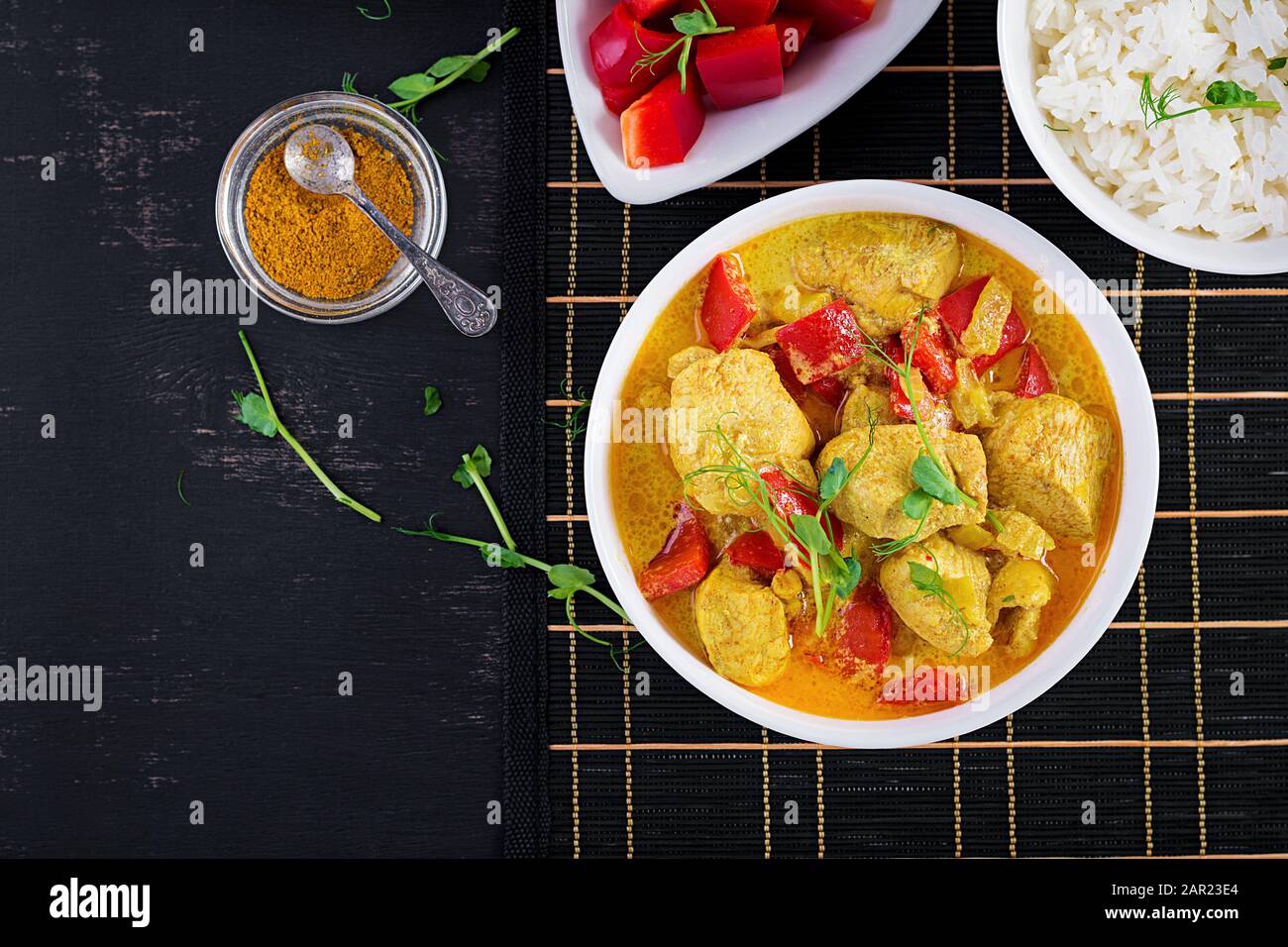 Indian chicken curry with basmati rice in bowl. Traditional Indian dish ...