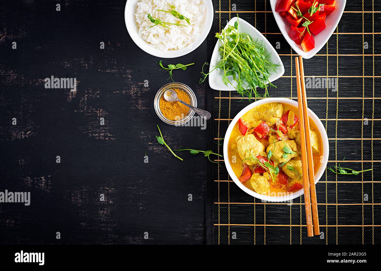 Indian chicken curry with basmati rice in bowl. Traditional Indian dish ...