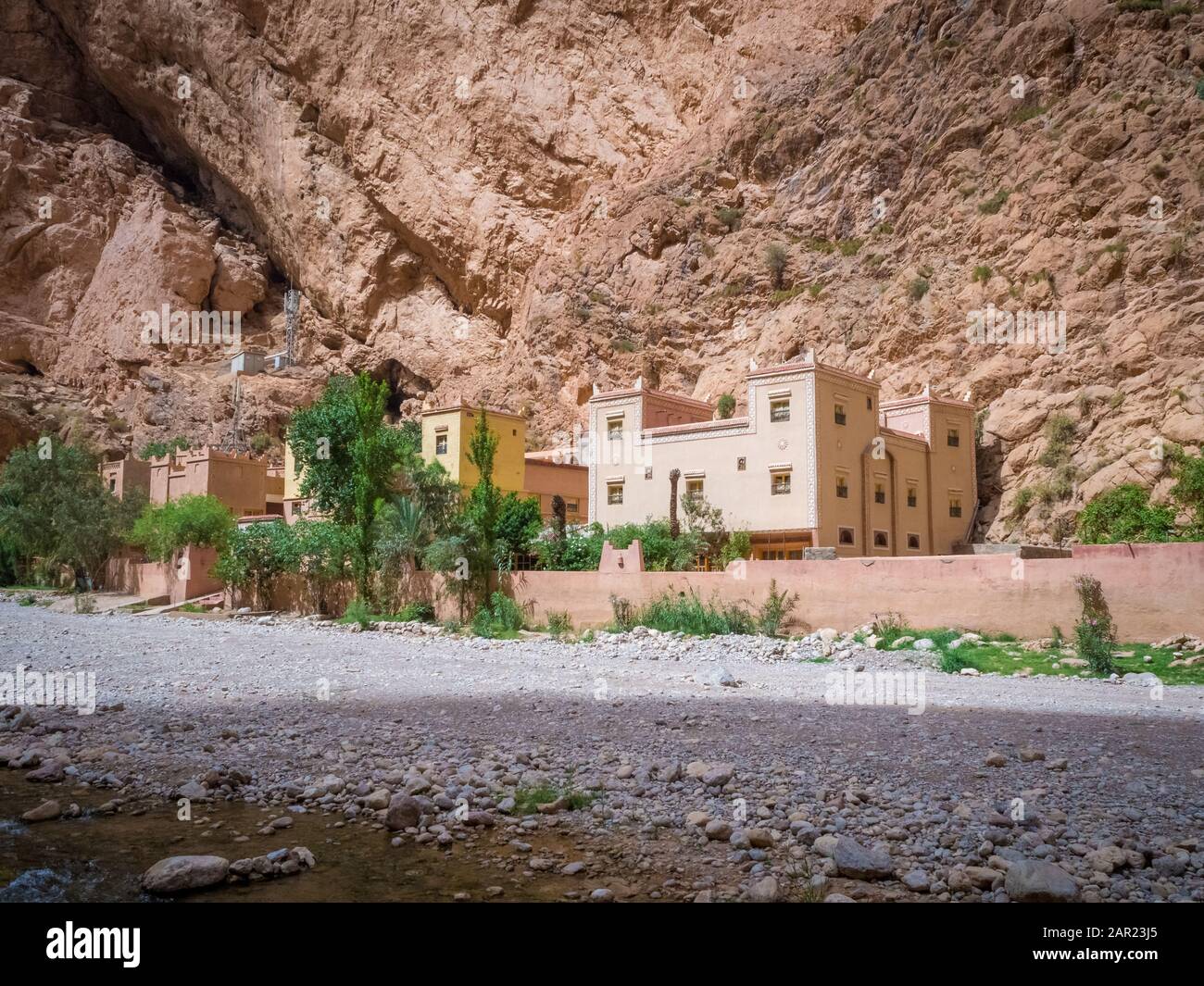 Todgha Gorges surrounded by greenery and buildings under the sunlight ...