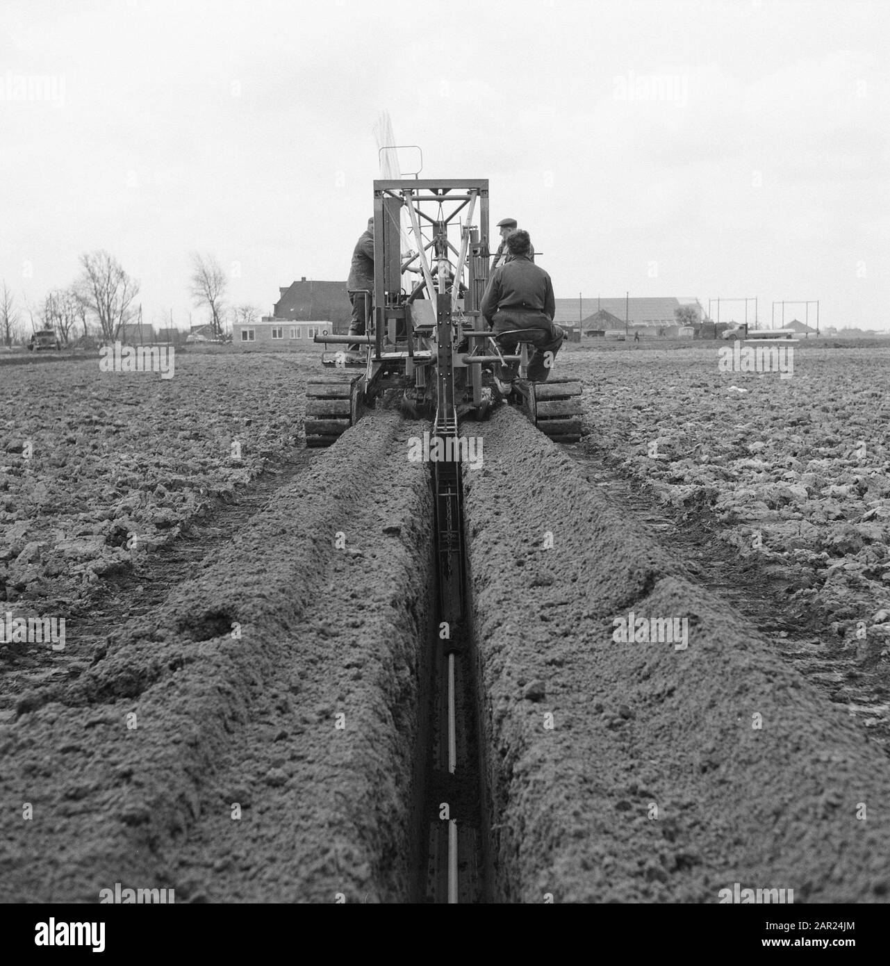 drainage, machinery, workers, plastic, drains Date: undated Keywords ...