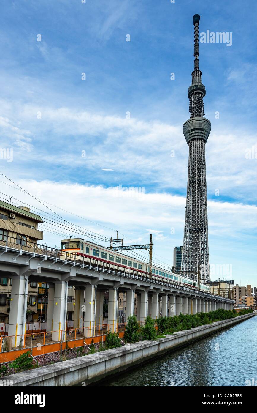 Vertical shot of the famous Tokyo Skytree tower with a train in the ...