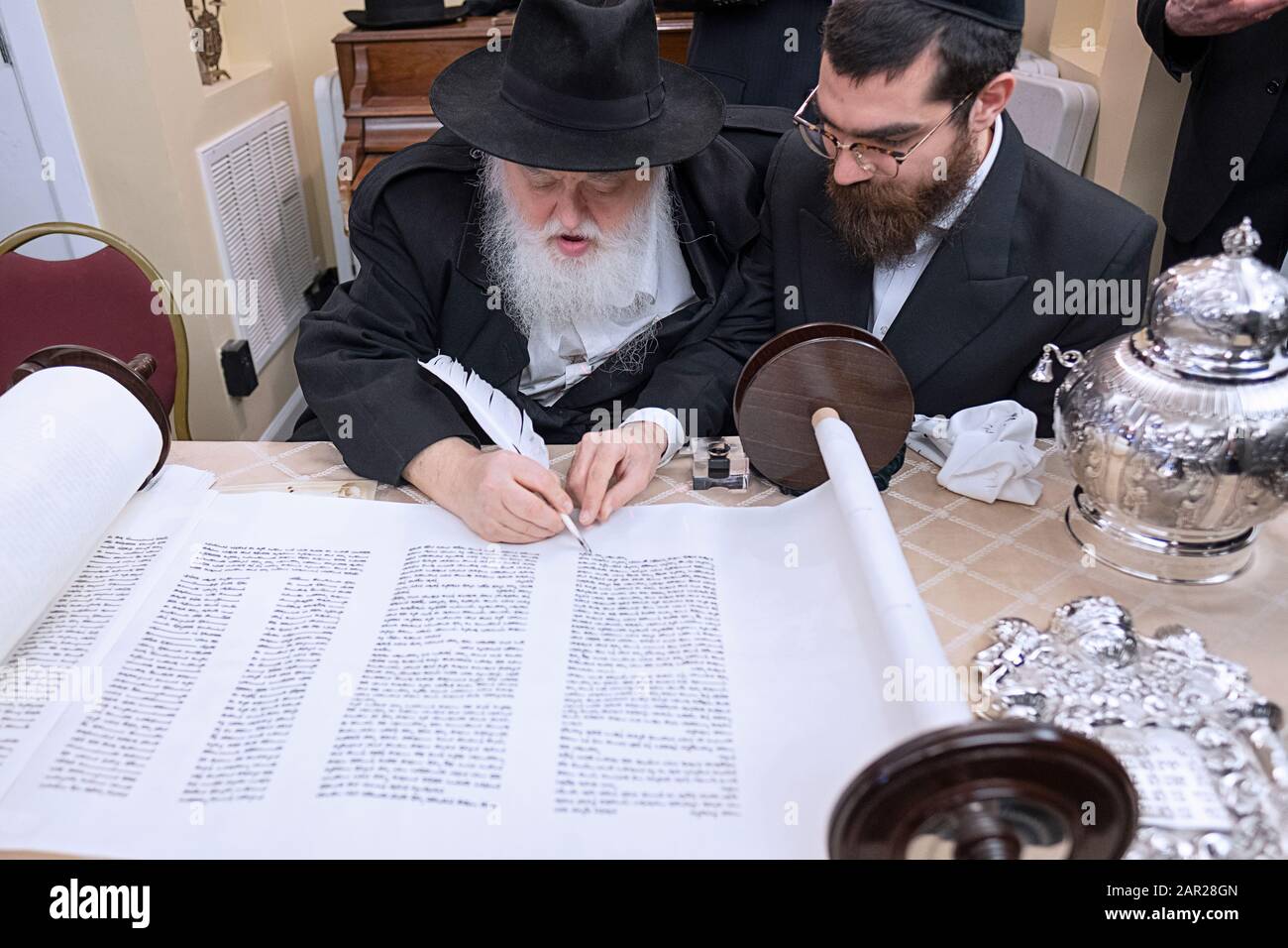 The completion of the writing of a new Torah is a communal process ...