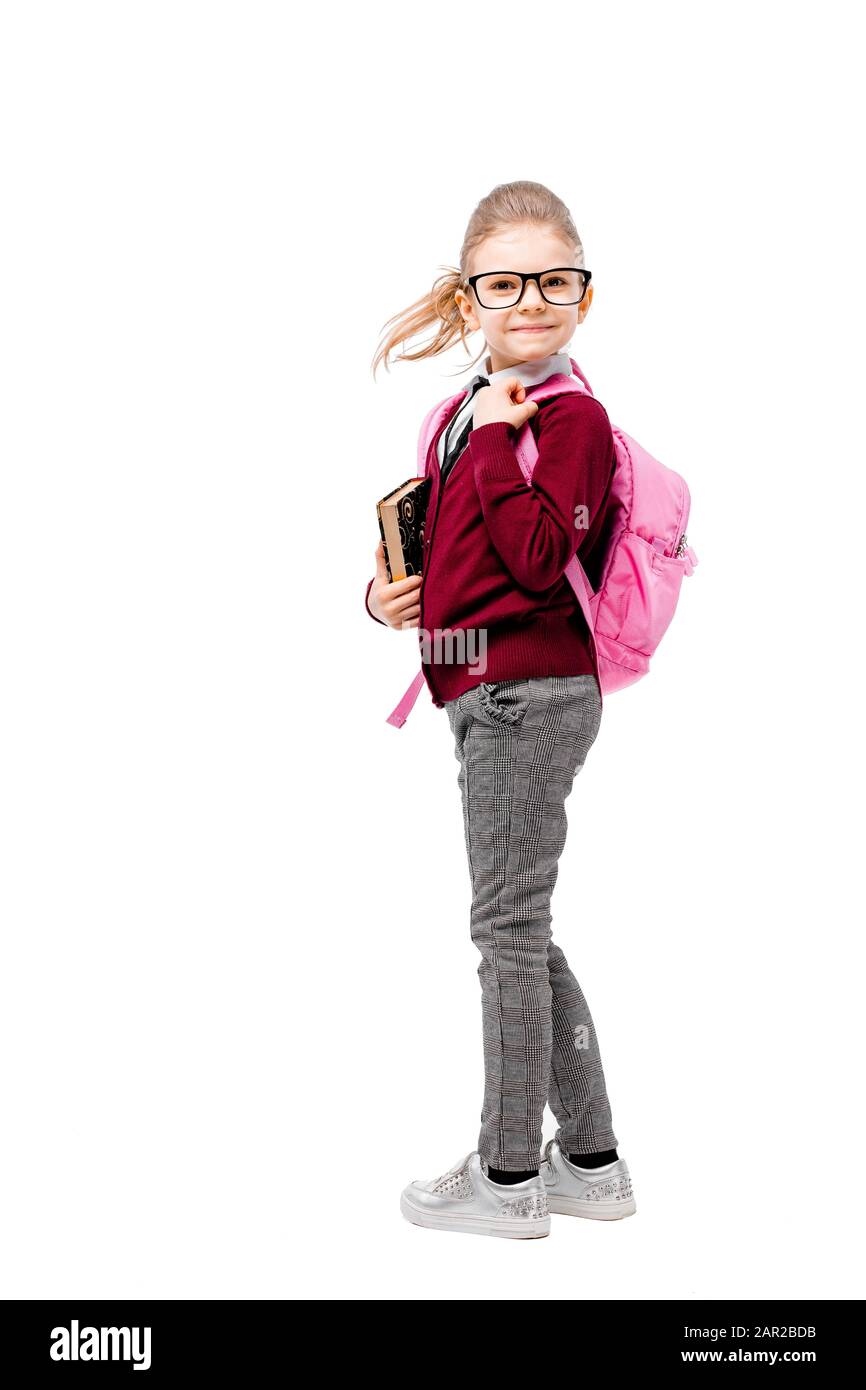 Child with schoolbag. Girl in white shirt and gray pants, rounded ...
