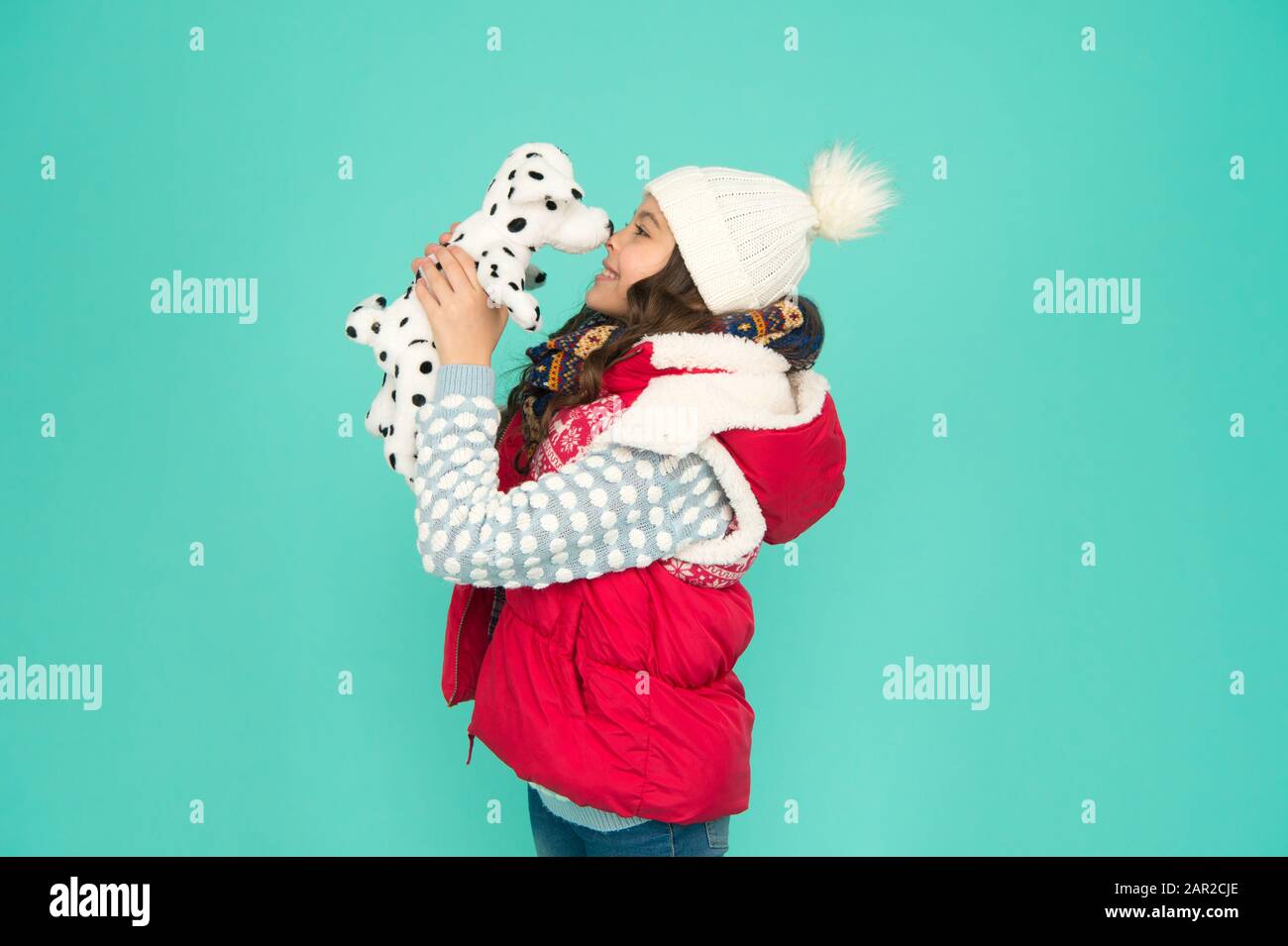 kid toy shop. small girl hold dog toy. kid love her fluffy pet puppy ...