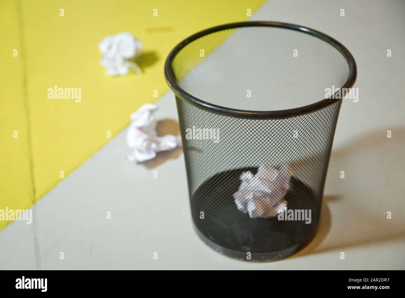 Image of man's hand throwing paper in the dustbin . Male hand throwing ...