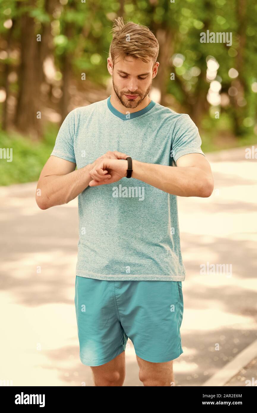 Combining technology with style. Fit man tracking his performance with ...