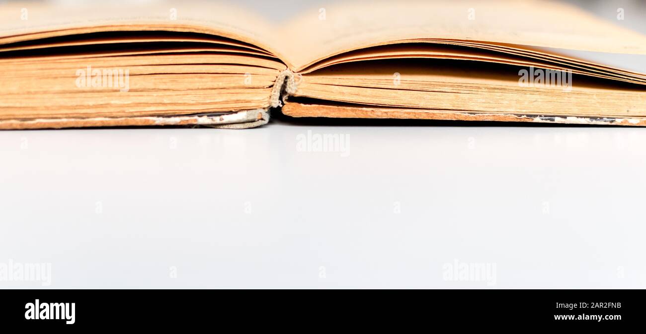 Close up shot of an open old science book containing equations and ...