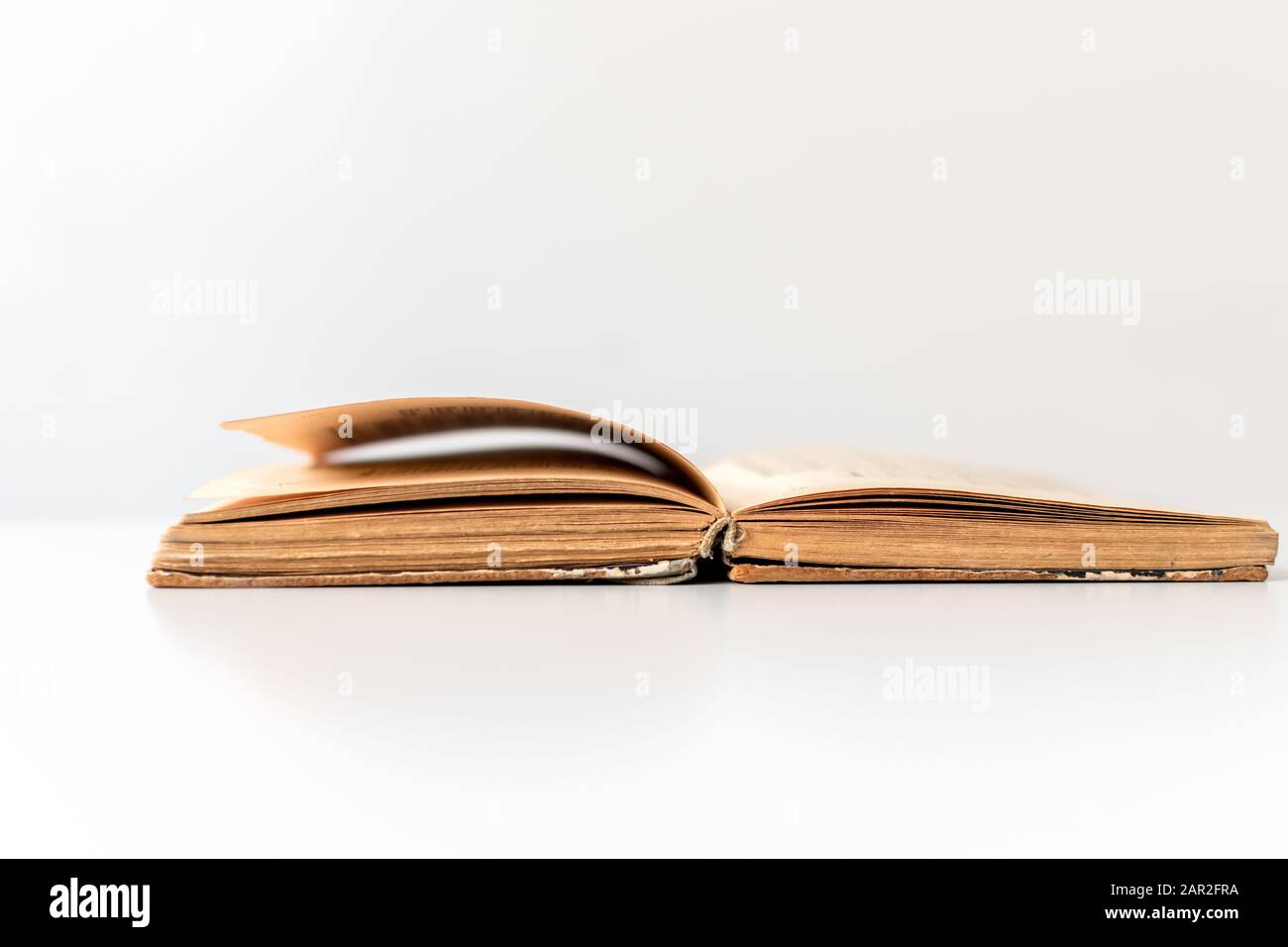 Close up shot of an open old science book containing equations and ...