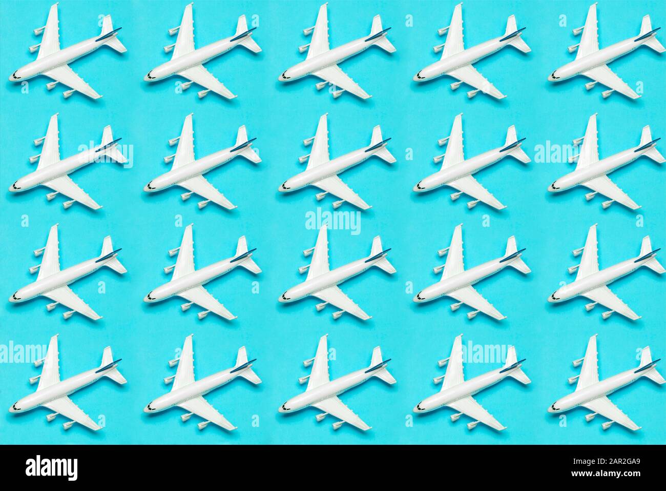 Travel minimal background. Model airplane in flight on an empty colored ...