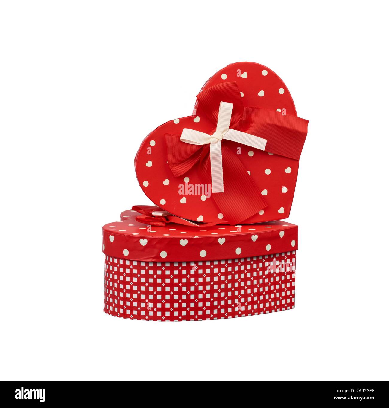 red heart-shaped cardboard box with bow isolated on white background ...
