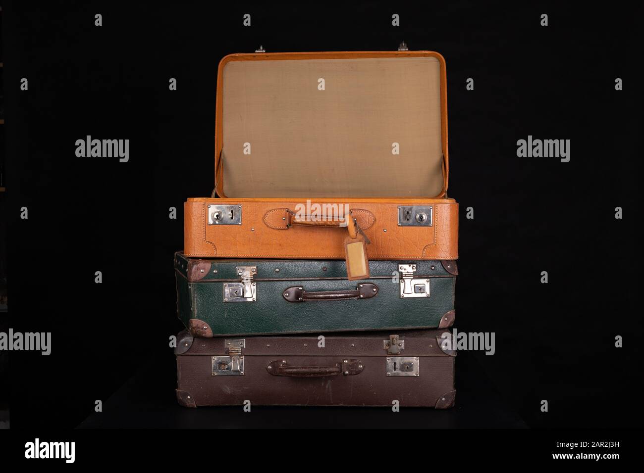 Old destroyed suitcases. Trunks used during long journeys. Dark ...