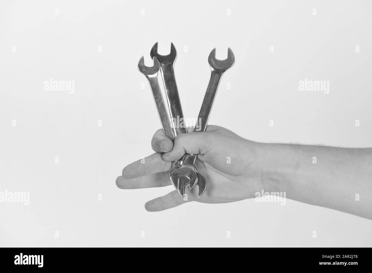 Spanner equipment made of metal. Repairer or mechanic hand holds ...