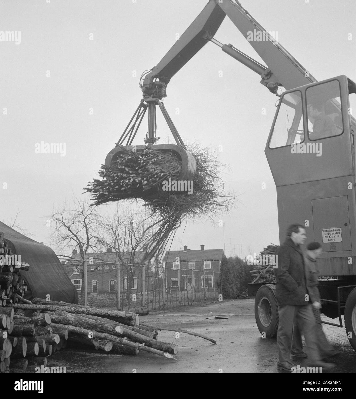 hoist work, workers, branches, tree trunks Date: undated Keywords ...
