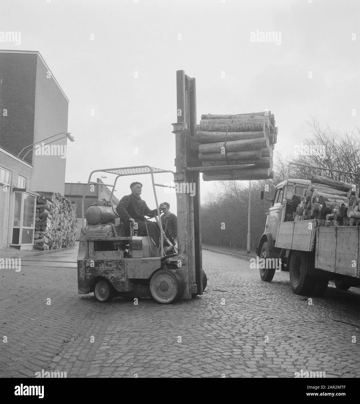 wood storage, loading works, logs, forklifts Date: undated Keywords ...