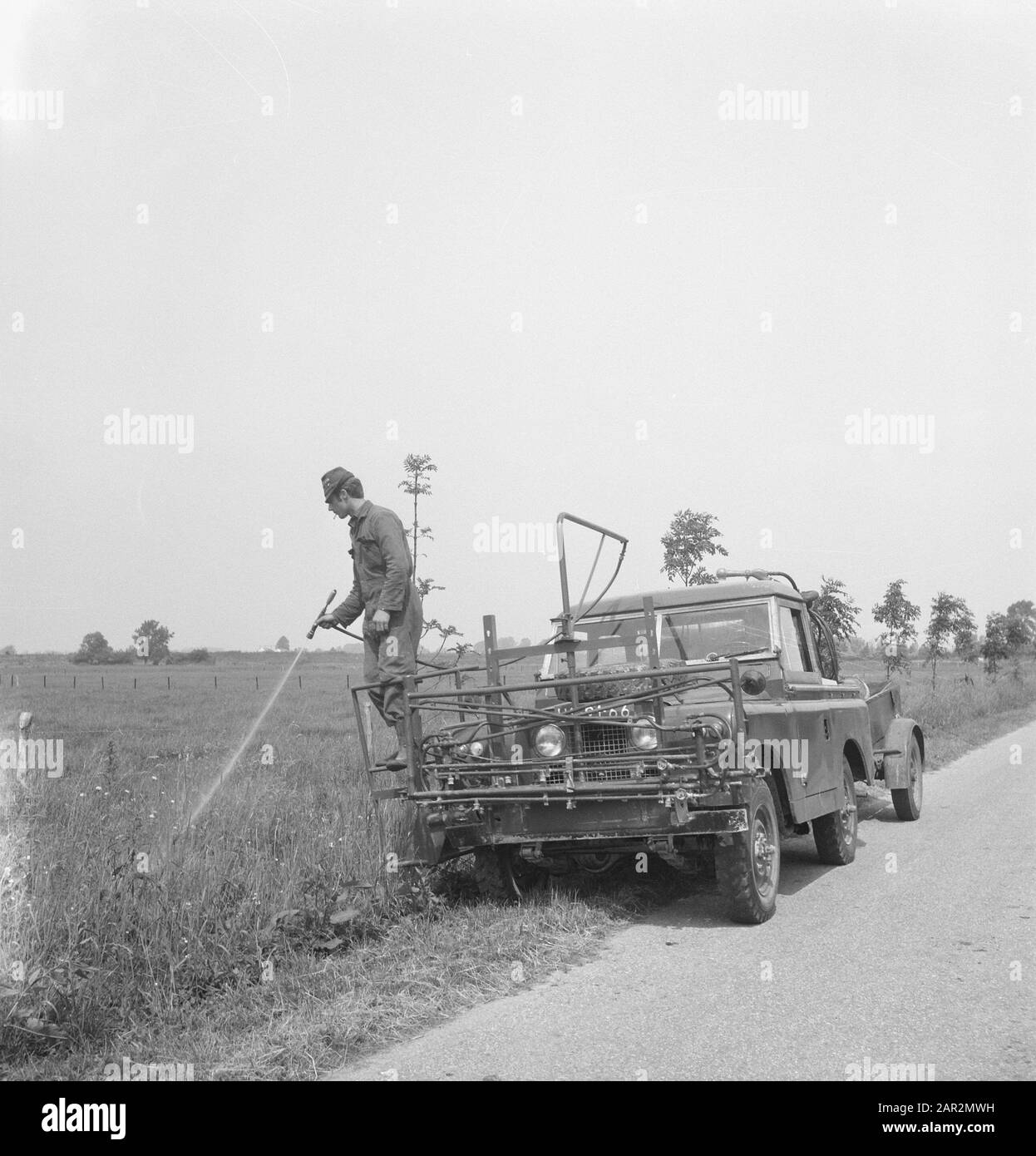 roads, roadside, spraying work, workers, spraying plants Date: undated ...