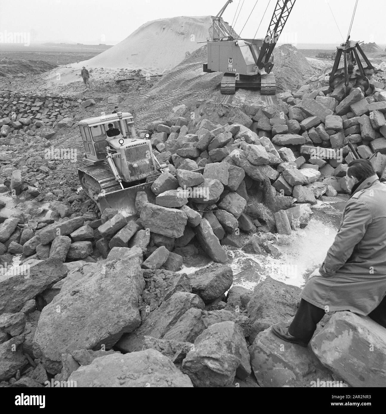 work, tools, workers, draglines, bulldozers, boulders Date: undated ...