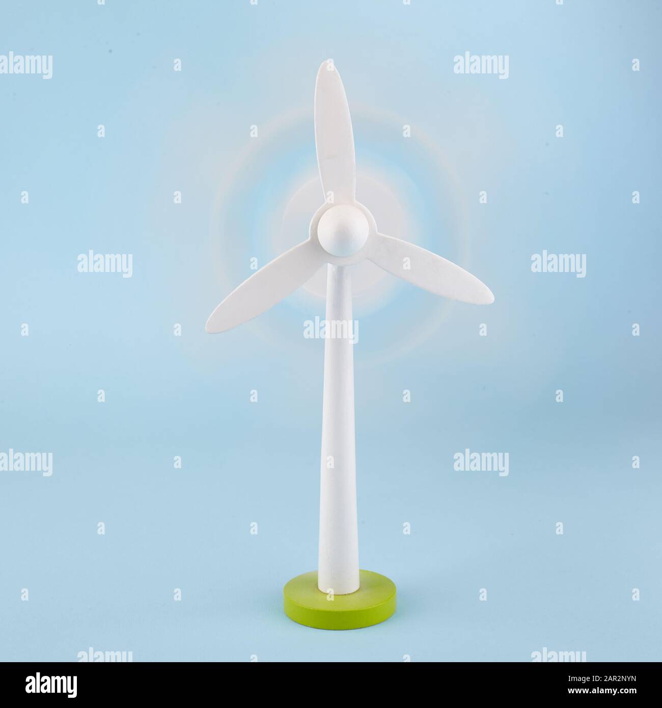 wind turbine wooden toy or light blue background, eco concept Stock ...