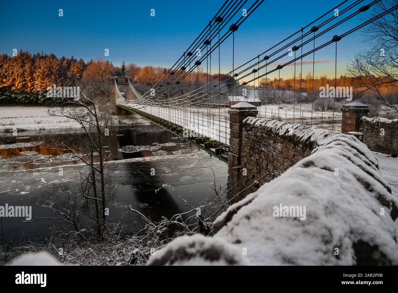 Winter at the Union Chain Bridge crossing the Tweed linking England and ...