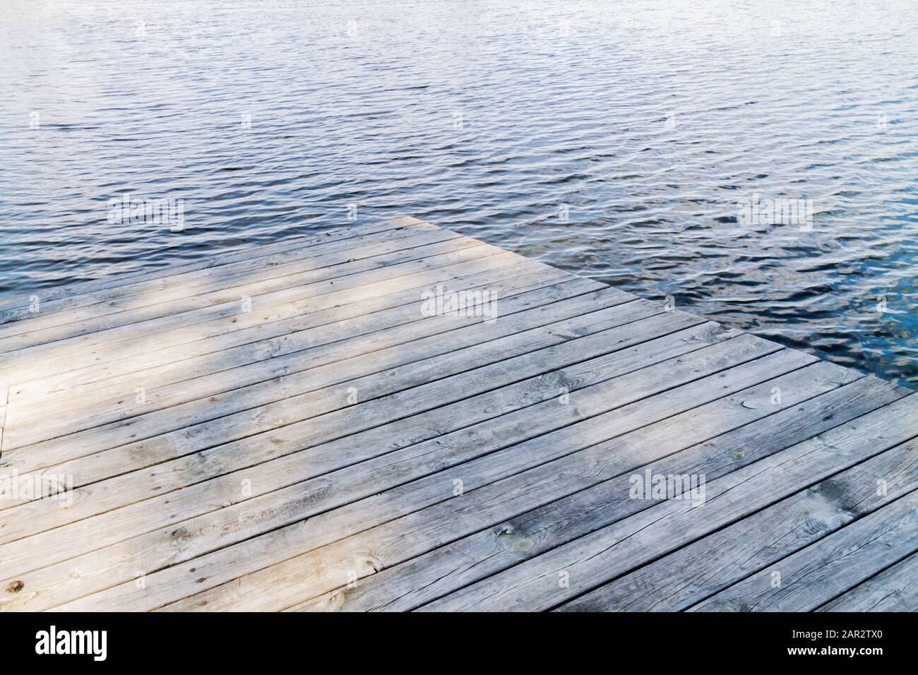 wooden pier on dark water background Stock Photo - Alamy
