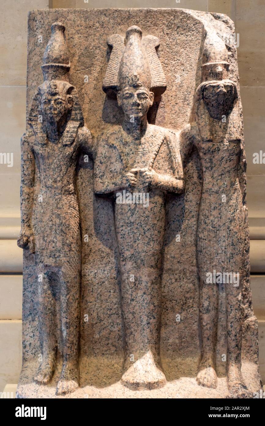 Red granite triple statue in gallery of Egyptian antiquities in the ...