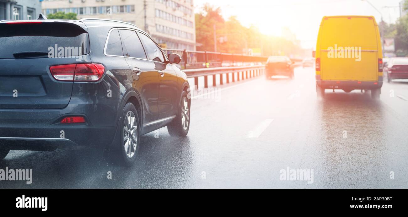 Wet highway after heavy rain with warm sunset evening sun on background ...