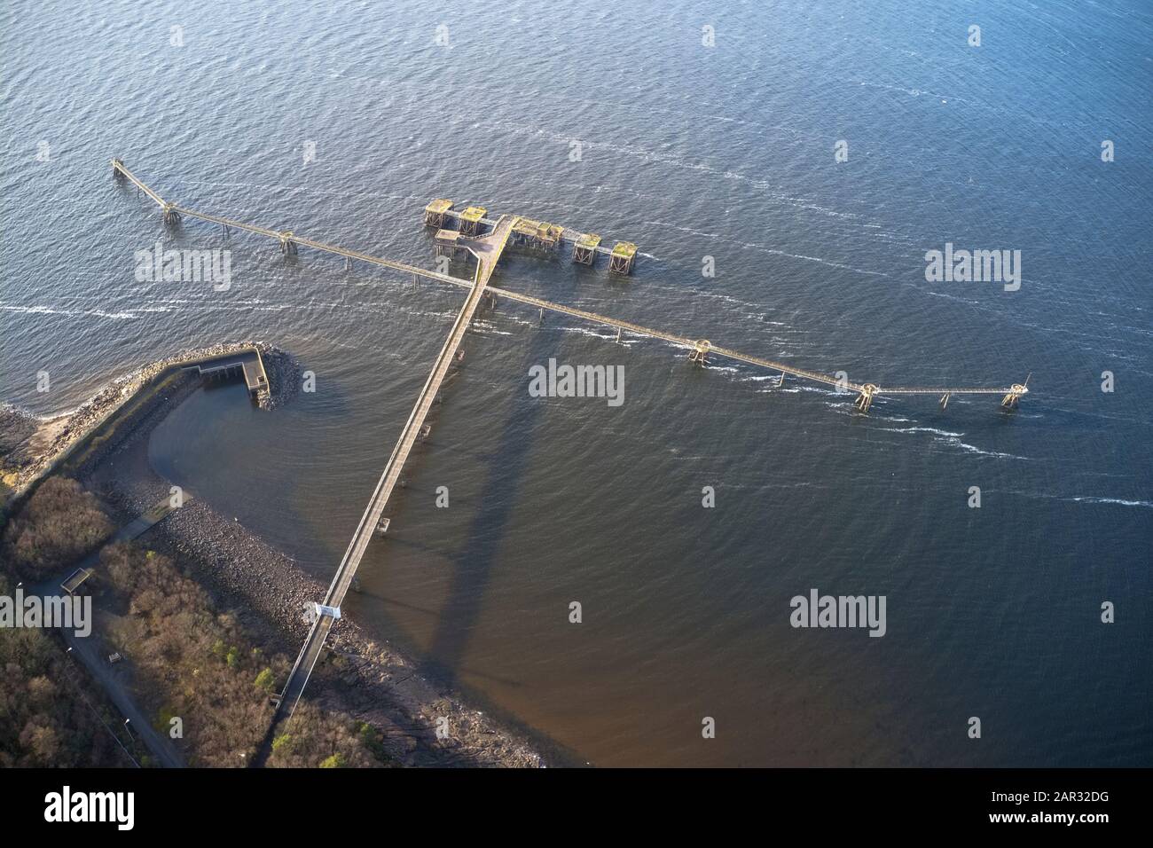 Large wooden pier jetty in sea aerial view from above at Inverkip power ...